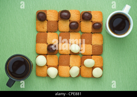 Sweet checkers of biscuits and chocolate drop Stock Photo - Alamy