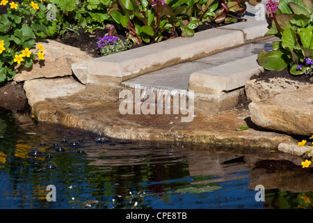 a garden with garden rill water feature made from copper water marginal ...