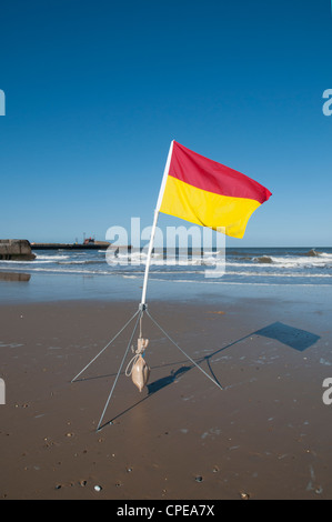 RNLI Safety Flag red and yellow Porthkidney Beach Lelant Cornwall Stock ...