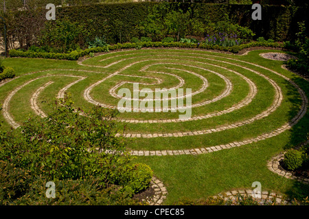Stone path maze in turf grass lawn at private garden, England Stock ...