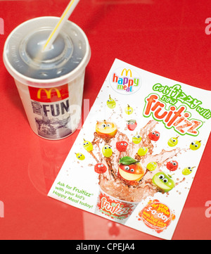 McDonalds paper drink cup with lid on yellow background, fast food ...
