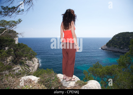 Woman on top at Menorca island in Spain Stock Photo - Alamy