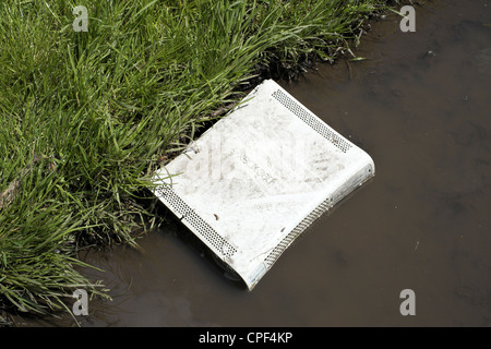 Broken XBox 360 dumped in a puddle of water at the side of the road ...