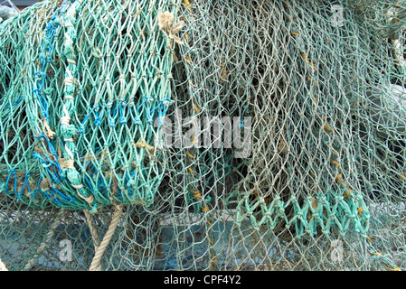 Fishing nets hanging off the back of a boat Stock Photo - Alamy
