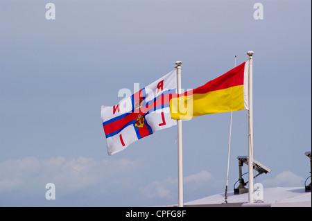 RNLI red and yellow rescue flag seen on the beach Stock Photo - Alamy