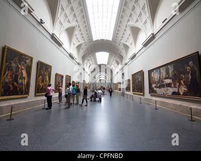 People inside a gallery at The Prado Museum in Madrid Spain looking at ...