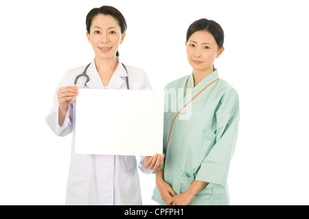 Young Asian woman showing medical examination report document during ...