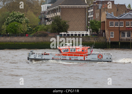 London Fire Brigade Fire and Rescue Boat on the River Thames with The ...