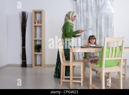 Traditional Middle Eastern dining setting with woven mats on tables and ...