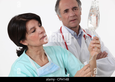 A nurse checking a perfusion Stock Photo - Alamy