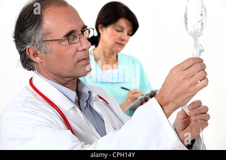 Nurse Preparing IV Medication For Patient Stock Photo - Alamy