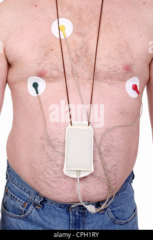 Portable heart monitor, Man wearing a portable electrocardiograph ...