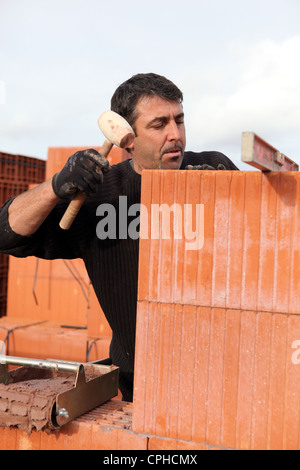 Business man hitting wall with a hammer Stock Photo - Alamy