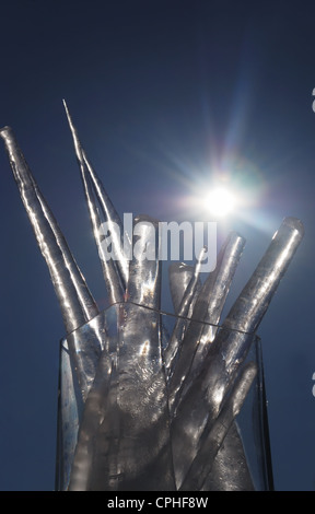 Spring background with icicles melting in the sun. Icicles close-up. Snow melting. Rustic scene ...