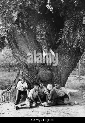 Group of children spend time in kindergarten with teacher or mum ...