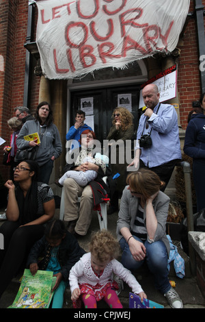 Local residents outside Kensal Rise Library attempt to prevent the ...