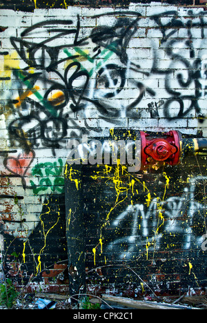 Colorful graffiti on a white brick wall Stock Photo - Alamy
