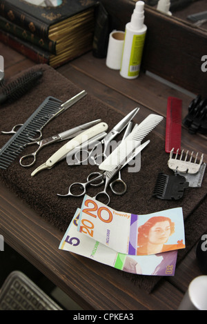 Brixton Pound notes in a barber shop. B£ is a local currency promoting ...