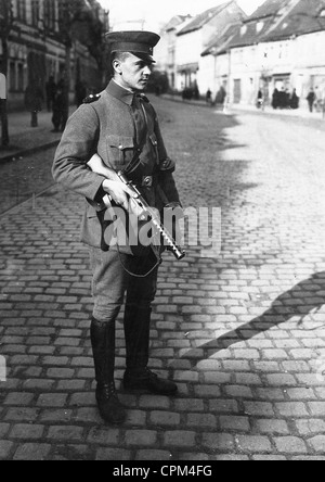 An armed German police officer in the main railway station in Berlin ...