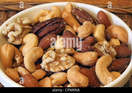 Mixed nuts including almonds, cashews, hazelnuts and walnuts sprinkled ...