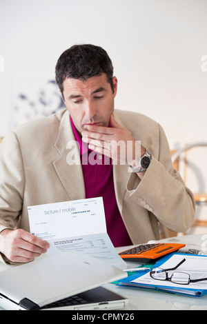 MAN FILLING OUT FORMS Stock Photo - Alamy