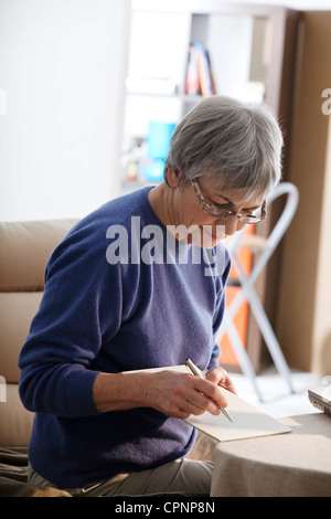 elderly woman write a letter Stock Photo: 26407635 - Alamy