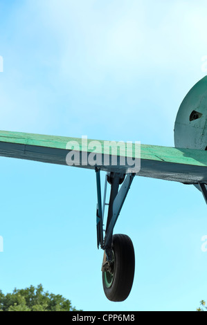 Bottom angle view of airplane in sky over city buildings Stock Photo ...