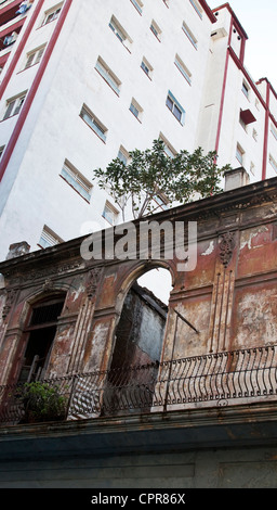 Derelict Building and Modern Apartments Stock Photo - Alamy