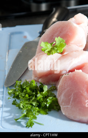 raw pieces of chopped poultry meat on the counter in a store. Top view ...