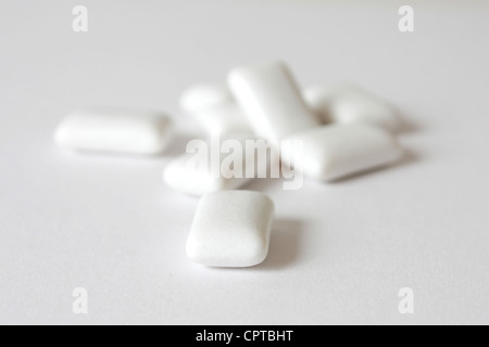 Chewing gum on the table. Mint refreshing tablet in a silver package ...