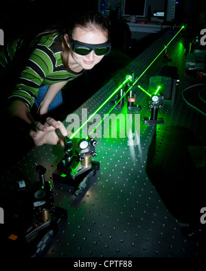 scientist doing research in a quantum optics lab (shallow DOF; color ...