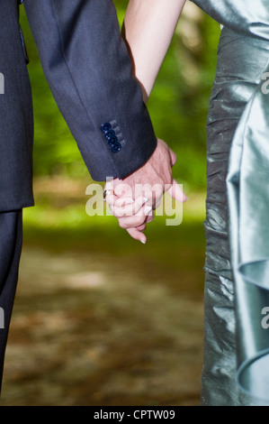 Bride and Groom Holding Hands at Wedding Table Setting Stock Photo - Alamy