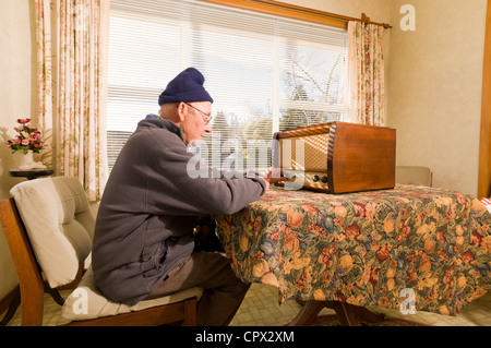 Man tuning the radio Stock Photo - Alamy