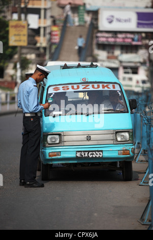 Nepal traffic police officer checking driving passes as the flow of ...