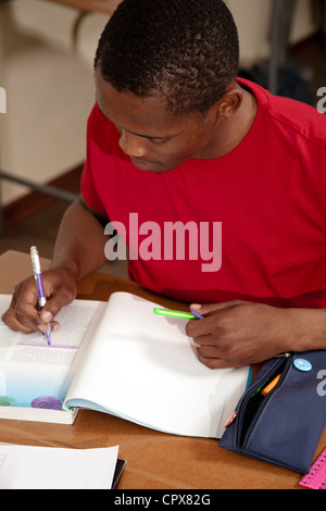 Top view of college student doing homework with mock-up tablet ...