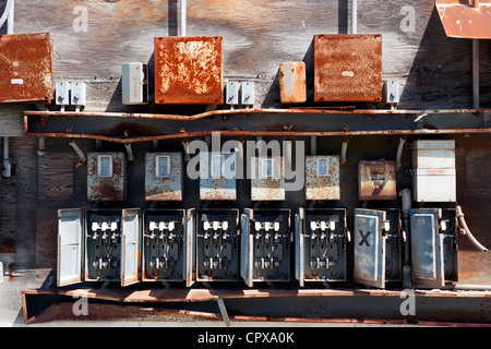 Rusty old electrical circuit breaker box on the exterior of an ...