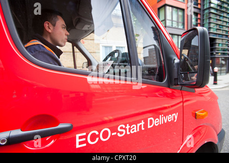 A Royal Mail van advertising its green credentials, the engine ...