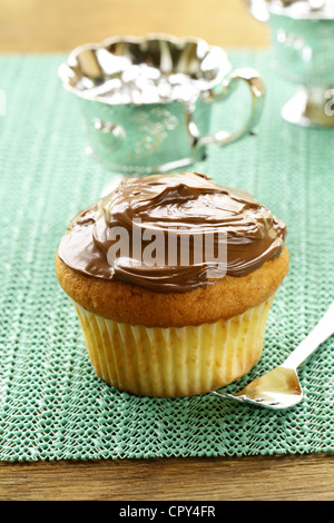 Cupcake with chocolate cream and silver sugar pearls Stock Photo - Alamy