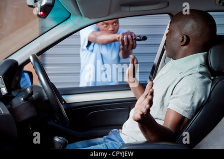 Inside view of a man getting hijacked in his car Stock Photo - Alamy
