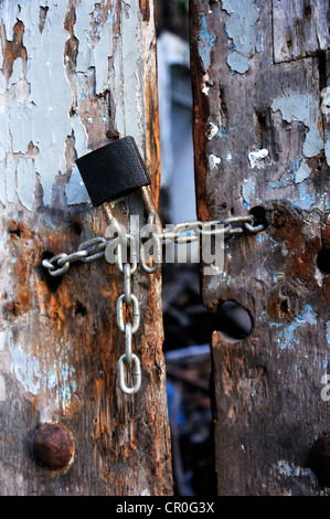 Padlock with chains on the old wooden background Stock Photo - Alamy