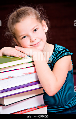 Old books leaning against each other for sale Stock Photo - Alamy