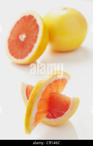 Half and quarter cut grapefruit isolated on white background Stock ...