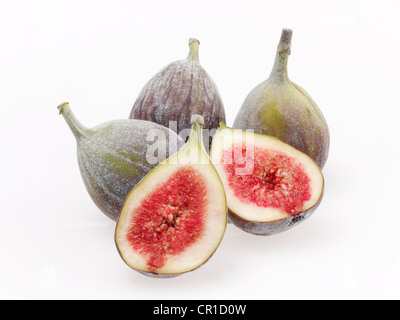 Three whole figs and two fig halves with knife FoodCollection Stock ...