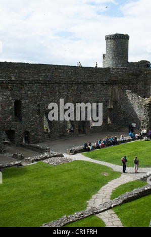 Harlech Castle dominates Harlech town with thick walls and astonishing ...