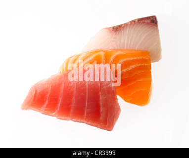 Fresh raw tuna slices arranged on white plate. Gourmet food preparation ...