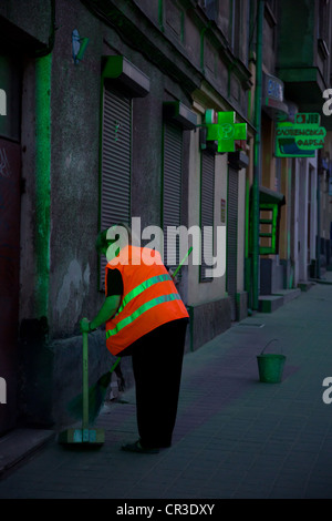 A female street sweeper in the morning, Lviv, Ukraine Stock Photo - Alamy