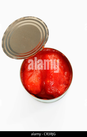 Opened tin can with red tomatoes and white isolated Stock Photo - Alamy