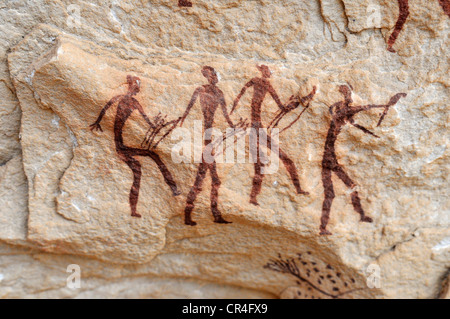 Group of painted warriors or hunters, neolithic rock art at Arakokem ...