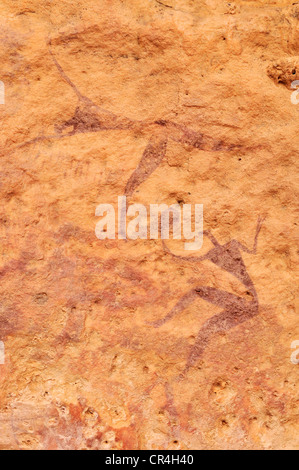 Neolithic rock painting of a human figure apparently swimming or ...