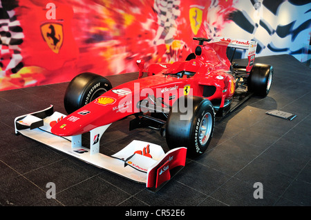 A Ferrari Formula One race car speeds past Israeli spectators during ...